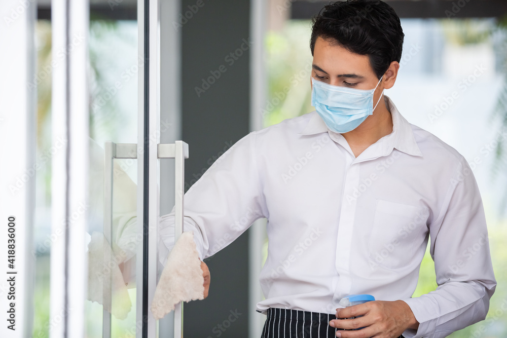 asian young man wear face mask white shirt wipe cleaning window glass ...