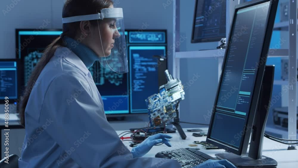 Female microelectronics engineer works in a modern scientific ...