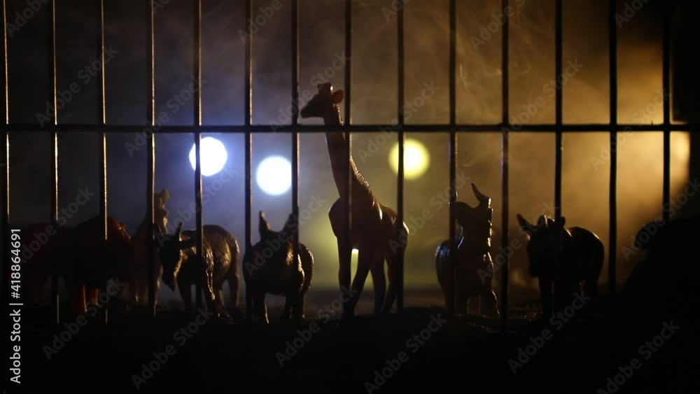 A group of animals inside a cage miniature. Wild animals in the zoo ...