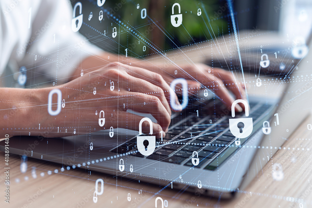A woman programmer is typing a code on computer to protect a cyber ...