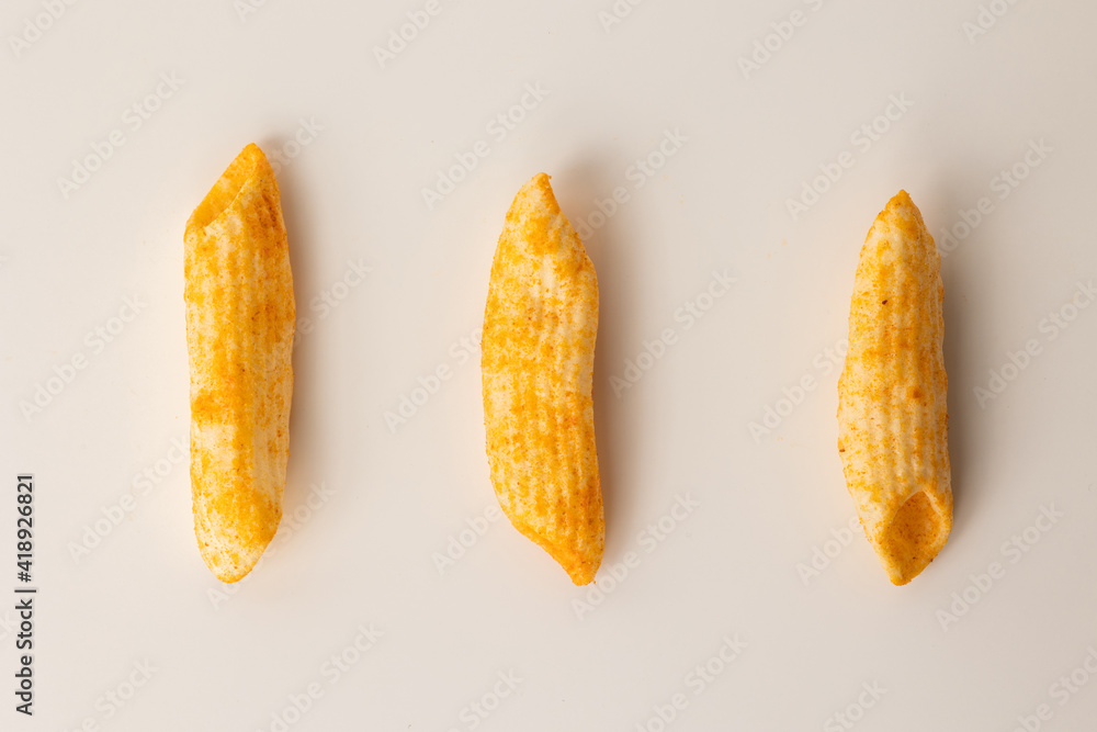 Crispy penne pasta shaped salty. Fast food or junk food snacks ...
