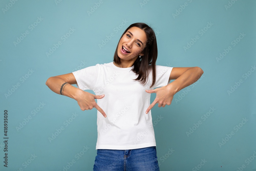 Photo of attractive positive surprised young woman pointing fingers ...
