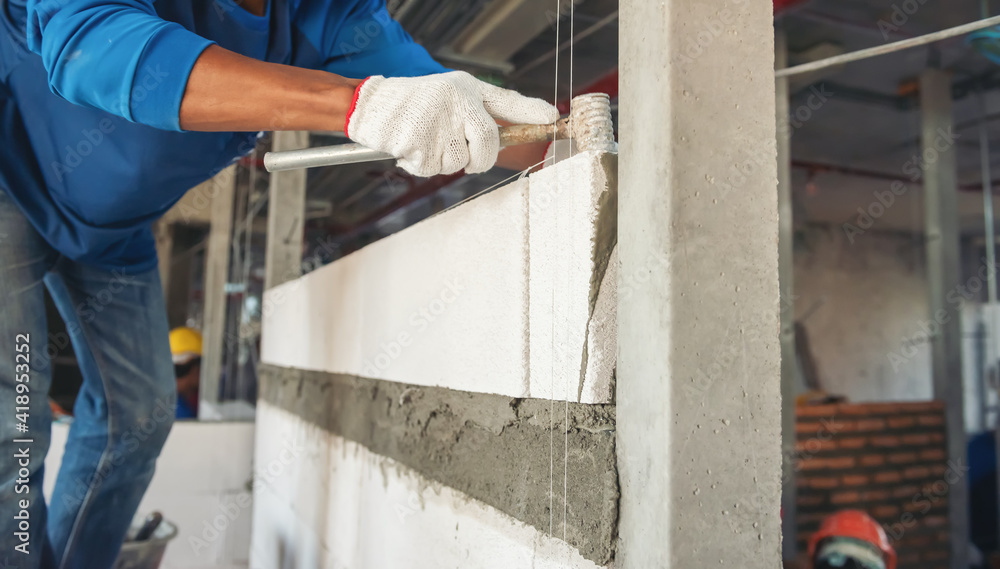 Construction worker man in uniform and safety equipment have job on ...