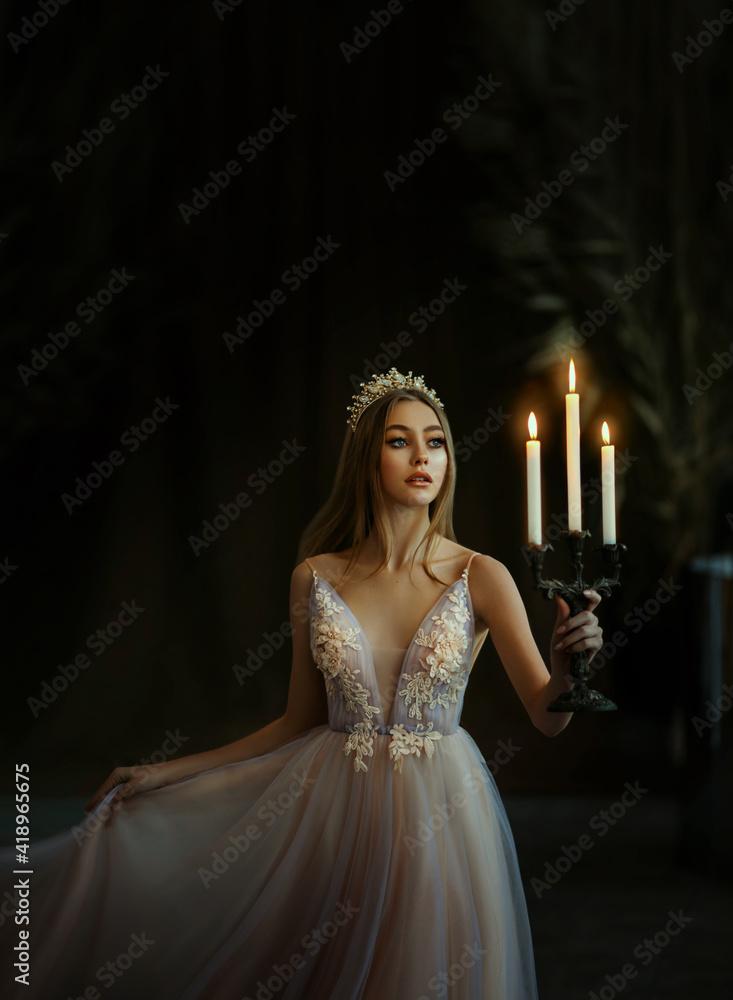 Art photo of medieval girl princess walks in dark gothic room. Woman ...