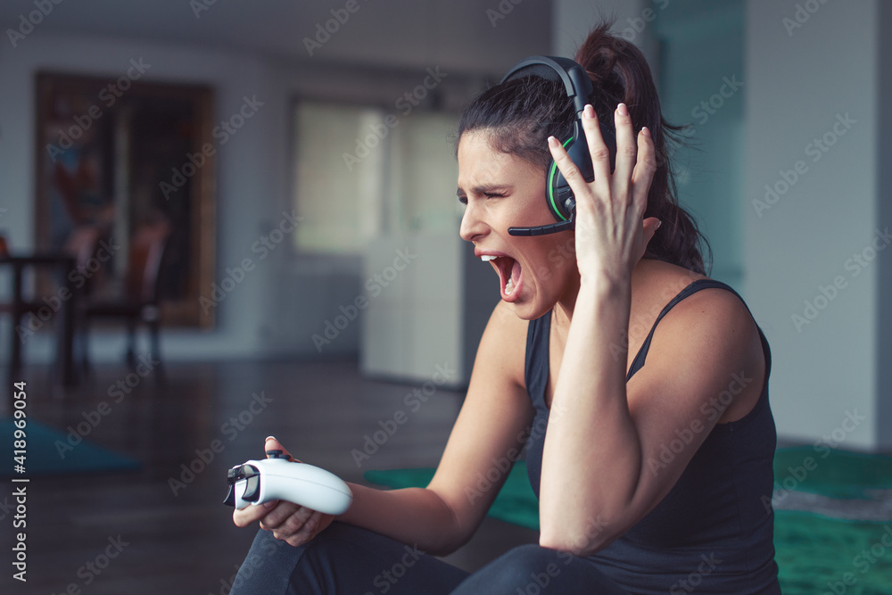 Young angry gamer woman shouting Stock Photo | Adobe Stock