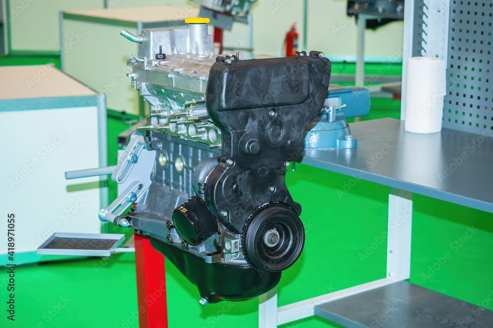 Car motor closeup. Engine is fixed to rack. Car engine repair. concept ...