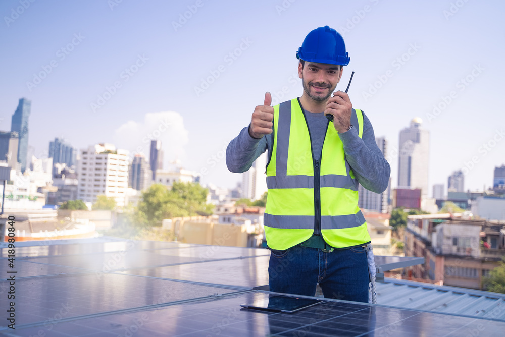 Engineer shows a thumbs up sign for showing good condition solar panels ...
