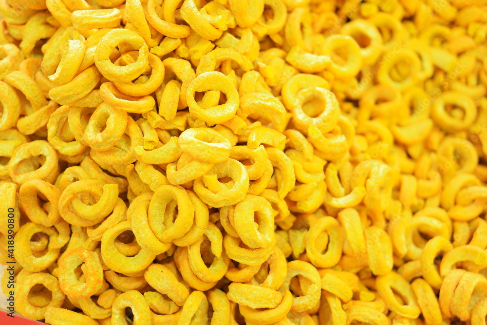 Pile of crispy corn rings close up. Heap of crunchy fried rings texture ...