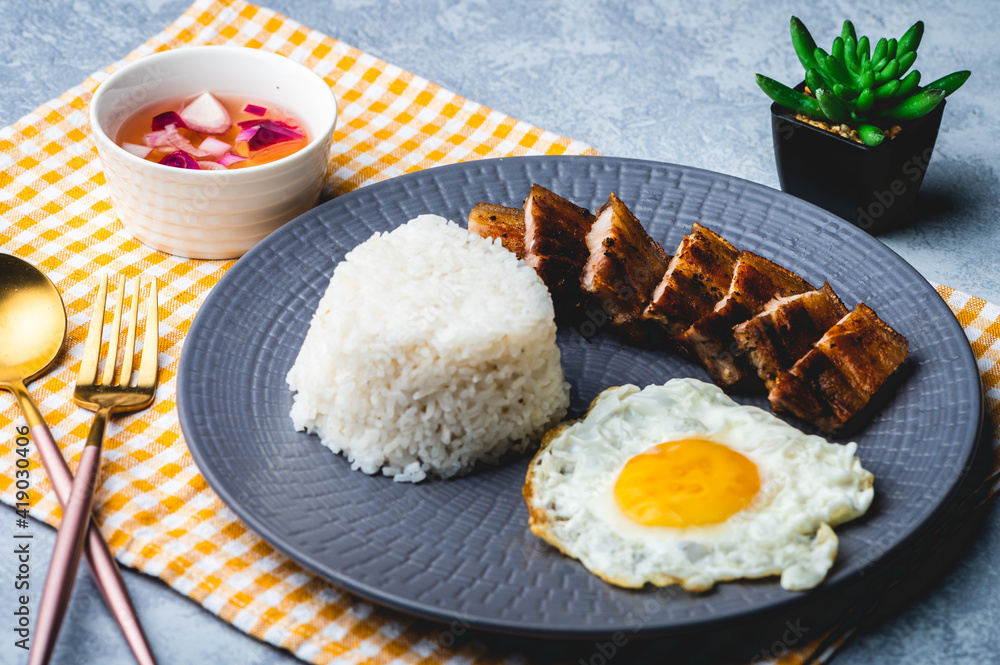 Porksilog ( full profile shot) -is a famous Filipino meal that consists of fried rice, egg and ...