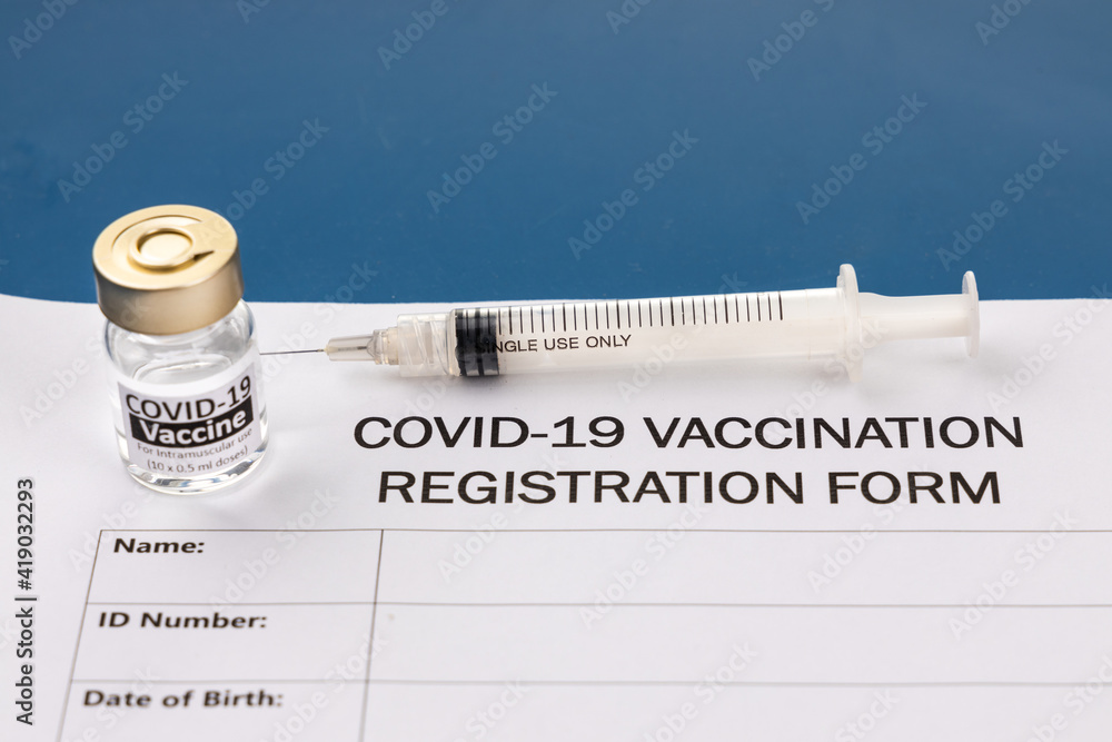Covid-19 vaccination registration form with vial and syringe on blue ...