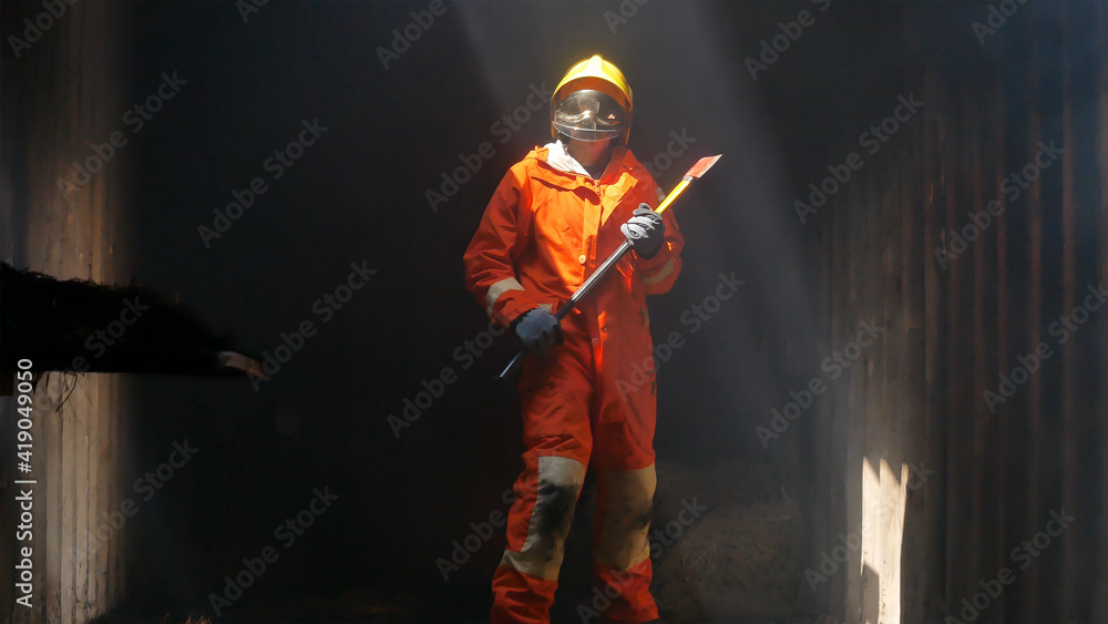 Firefighter fighting with flame using fire hose chemical water foam ...