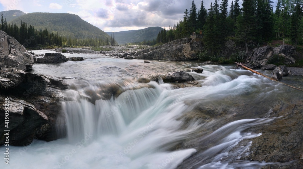Panorama of Elbow falls on a rainy day. Summer travel to Kananaskis ...