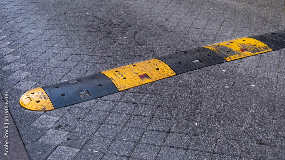 Speed bump on the street Stock Photo | Adobe Stock