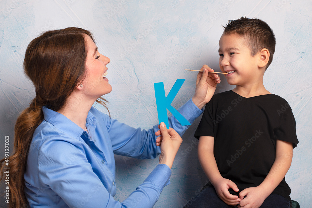 Foto de Children speech therapy concept. Preschooler practicing correct ...