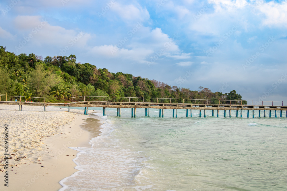 a beautiful small natural island with a turquoise water and wight ...