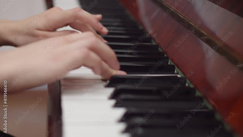 Vidéo Stock Musician woman playing piano keys with hands. Artist is ...