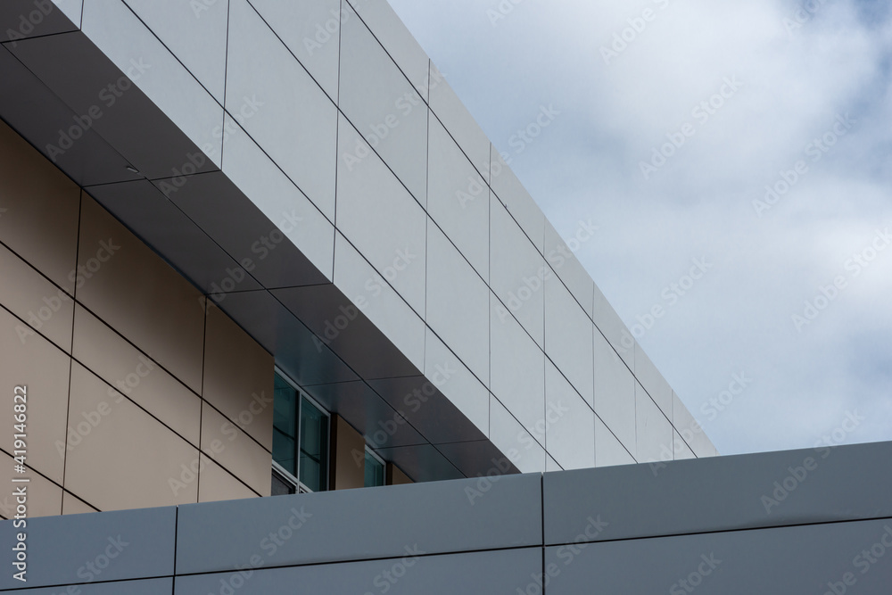 The exterior wall of a contemporary commercial style building with ...