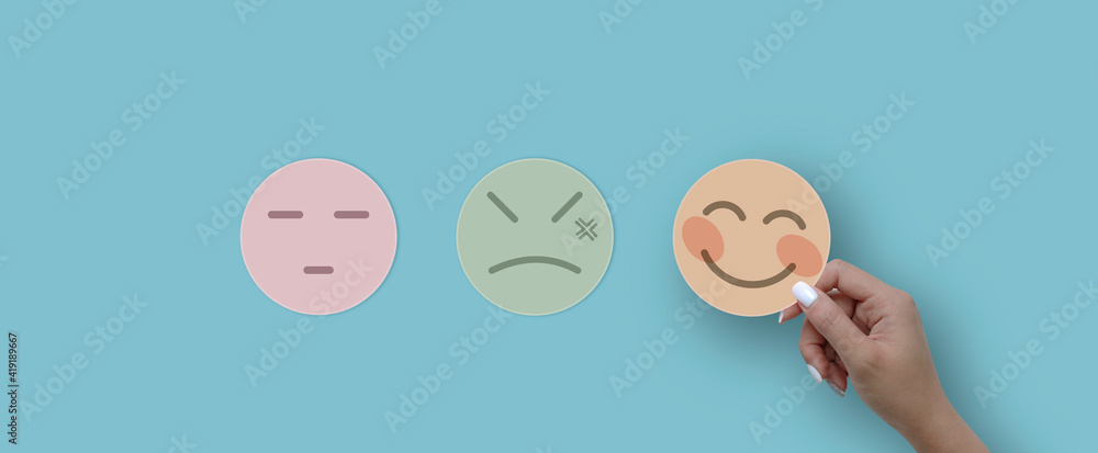Woman hand choosing happy smile face paper cut, feedback rating and ...