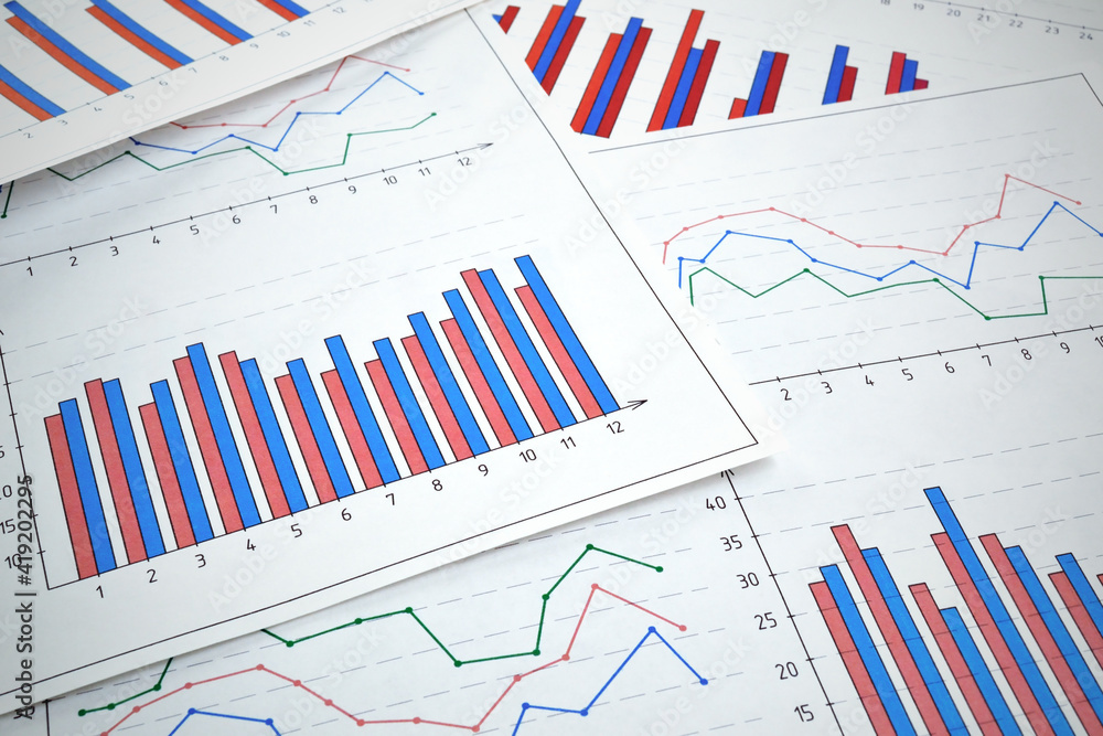 Photos of charts, diagrams and numbers showing the rise and fall in the ...