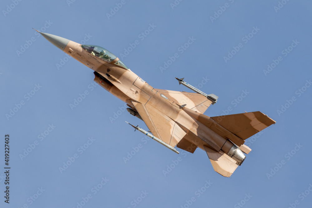 F16 fighter jet. F-16 Fighting Falcon jet. Dessert camouflaged Fighter ...