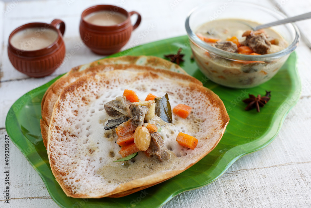Appam, Hoppers and mutton stew Kerala breakfast food and Indian milk ...