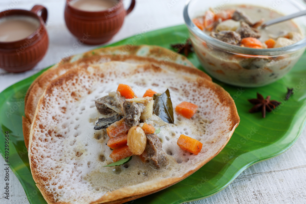Appam, Hoppers and mutton stew Kerala breakfast food and Indian milk ...