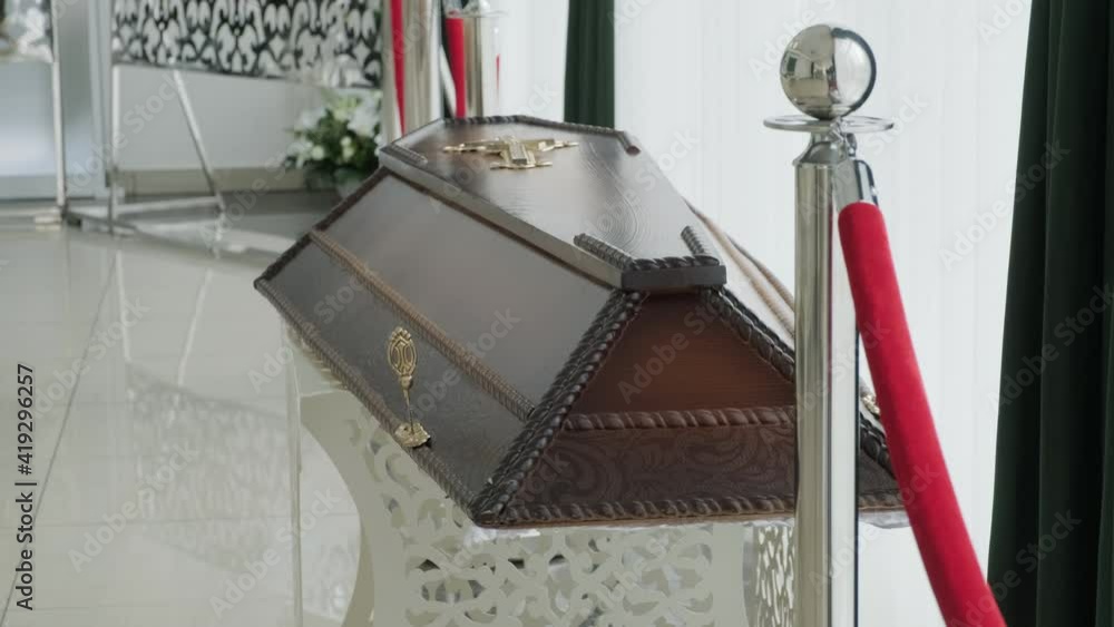 Funeral ceremony. The coffin in the funeral chapel. Church rose ...
