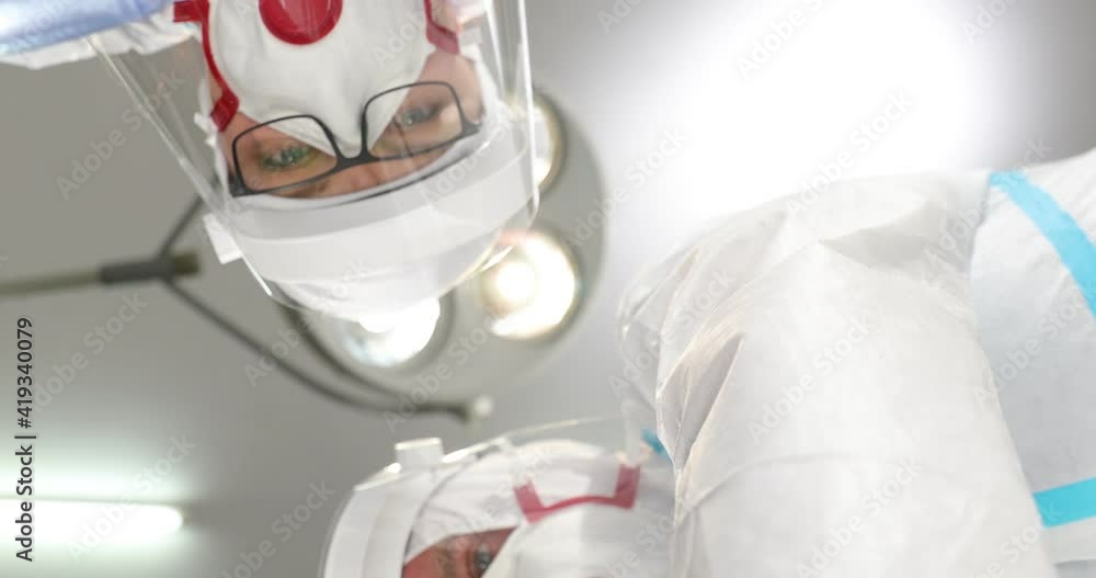Team of Doctors wearing coverall Face Masks Doctors putting an oxygen ...
