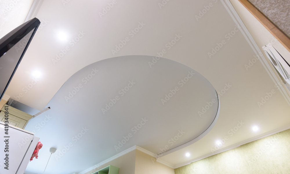 Two-level suspended ceiling, the lower level is made of plasterboard ...