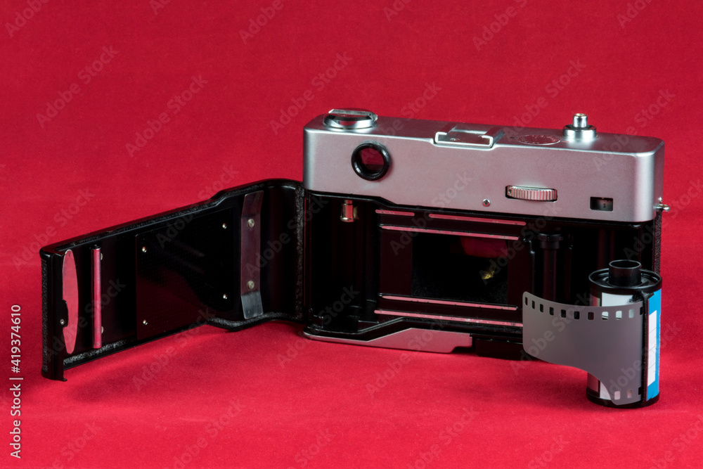 Vintage Film Rangefinder Camera with Open Back and Roll of Film on a ...