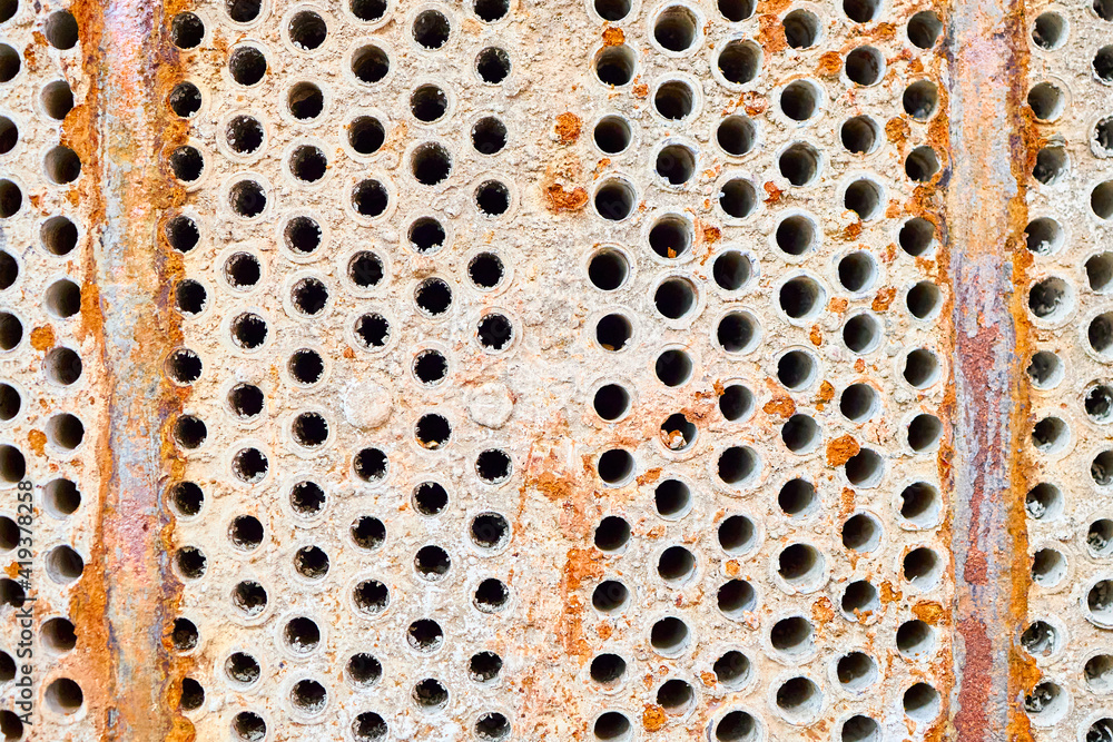 Tube sheet or plate of heat exchanger boiler closeup background ...