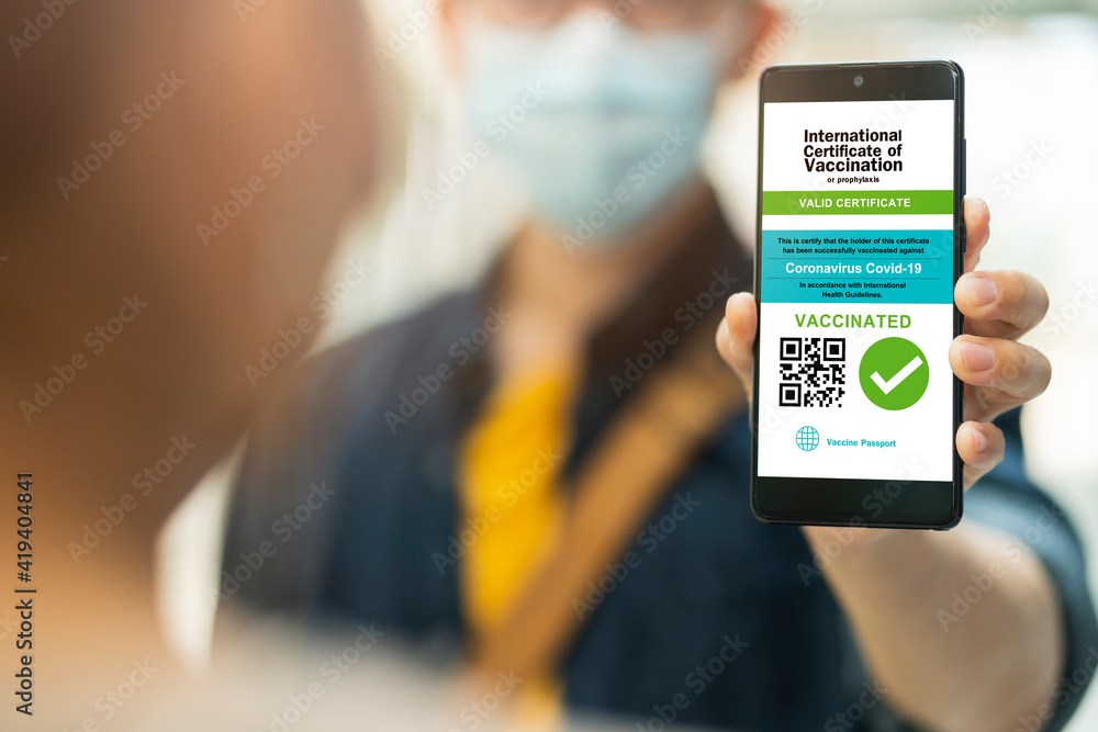 Smartphone displaying a valid digital vaccination certificate passport ...