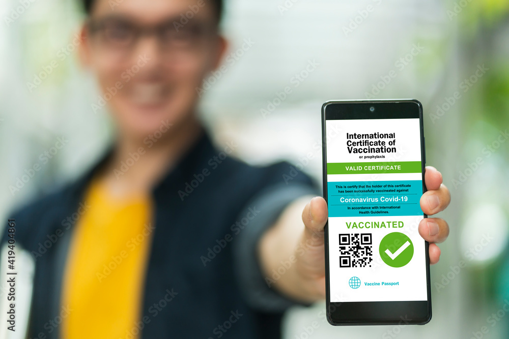 Smartphone displaying a valid digital vaccination certificate passport ...