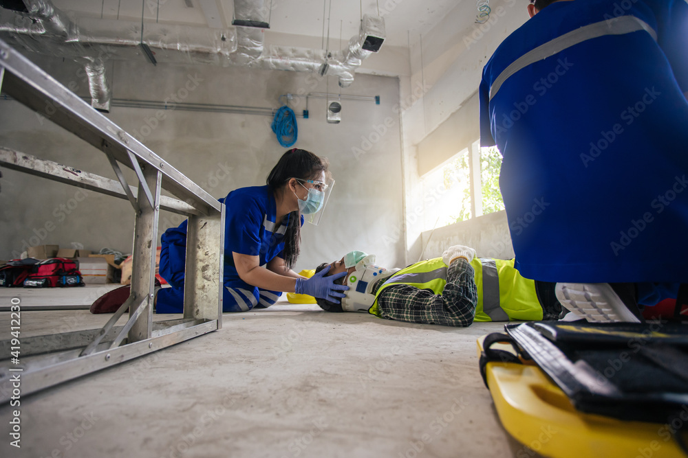 First aid builder accident in site work. Team paramedic first aid for ...