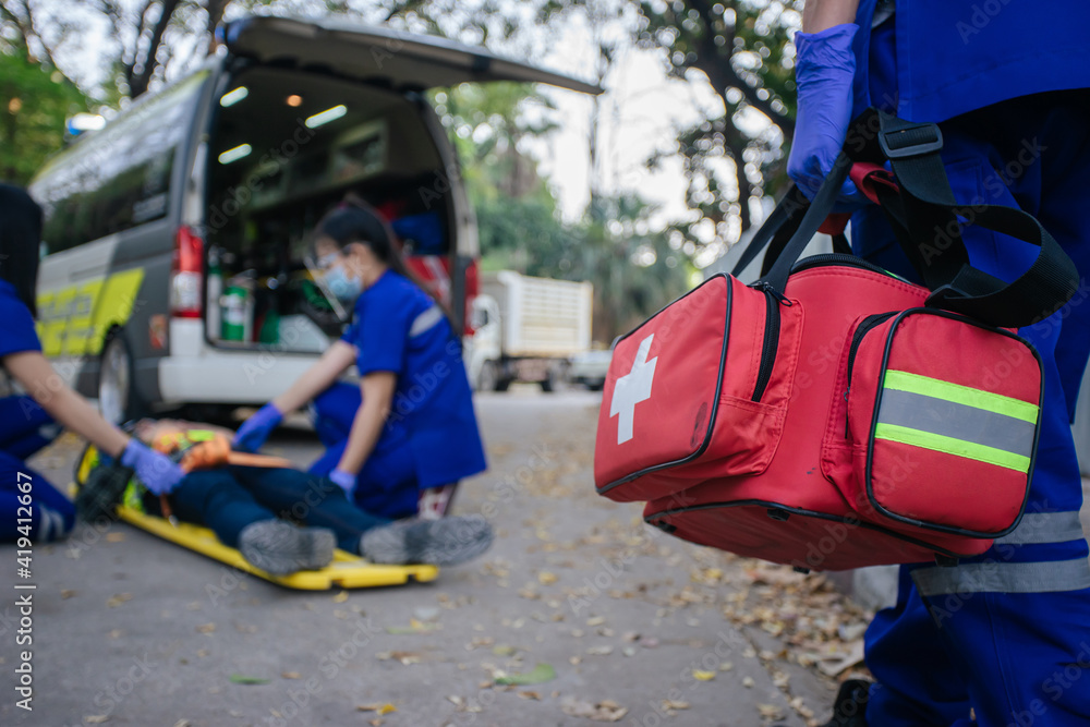 Selective focus is first aid bag. Team paramedic firs aid accident on ...