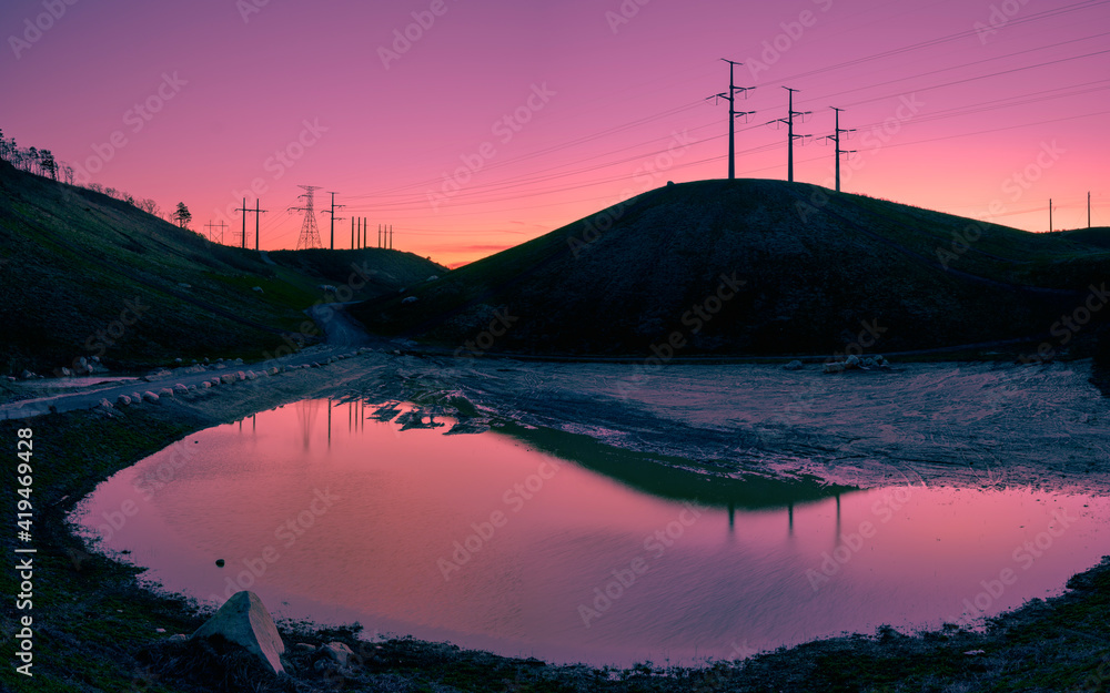 Pink Night Landscape with Electricity Pylons on High Dunes and Water ...