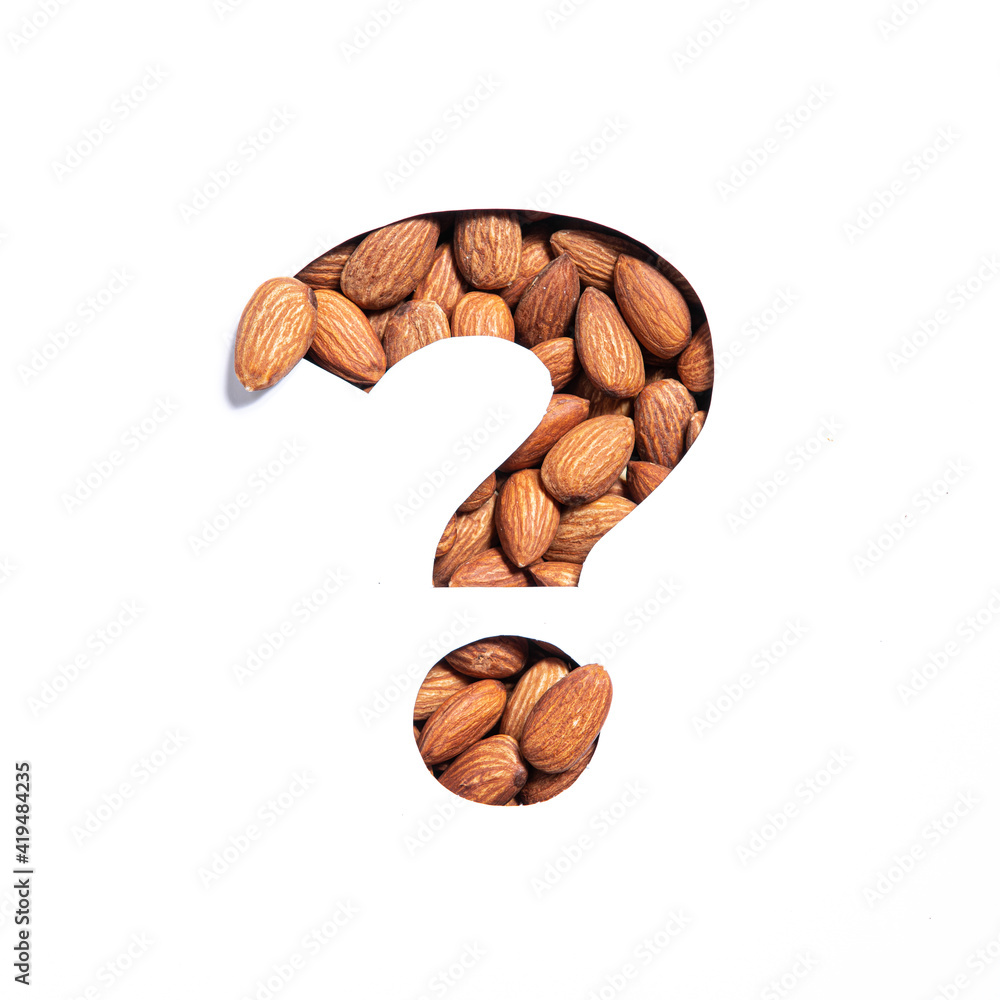 Question punctuation mark of almonds and cut paper isolated on white ...