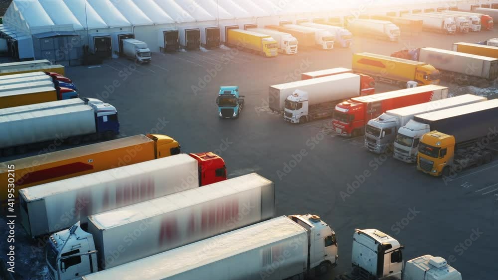 Semi-trailers trucks stand at warehouse parking lot and wait for load ...