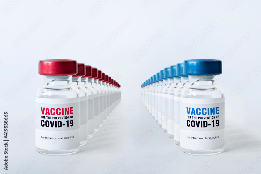 many bottles of covid 19 coronavirus vaccine on white table. The ...