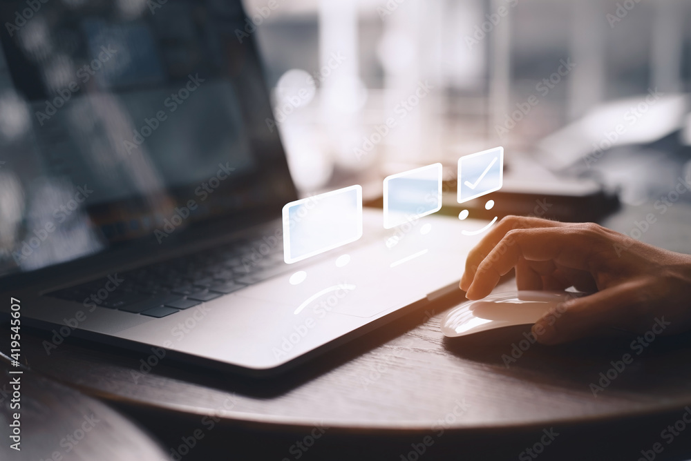 Business woman pressing face emoticon on the keyboard laptop and ...