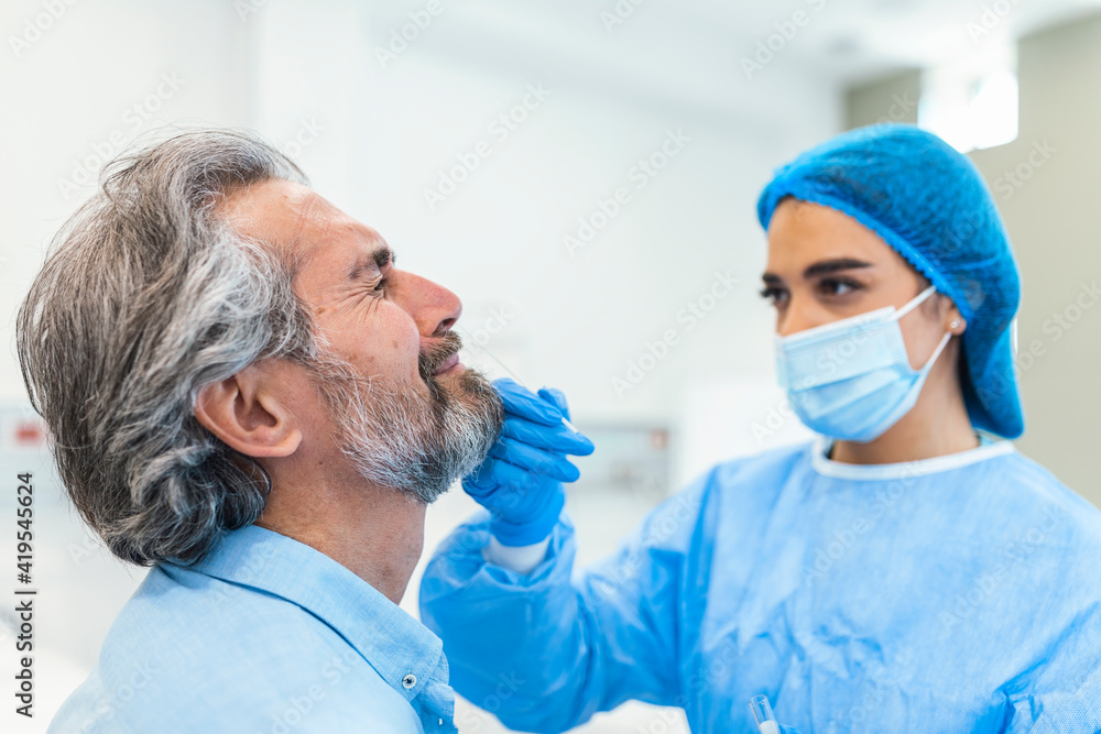 Close up of general practitioner performs coronavirus swab PCR test ...