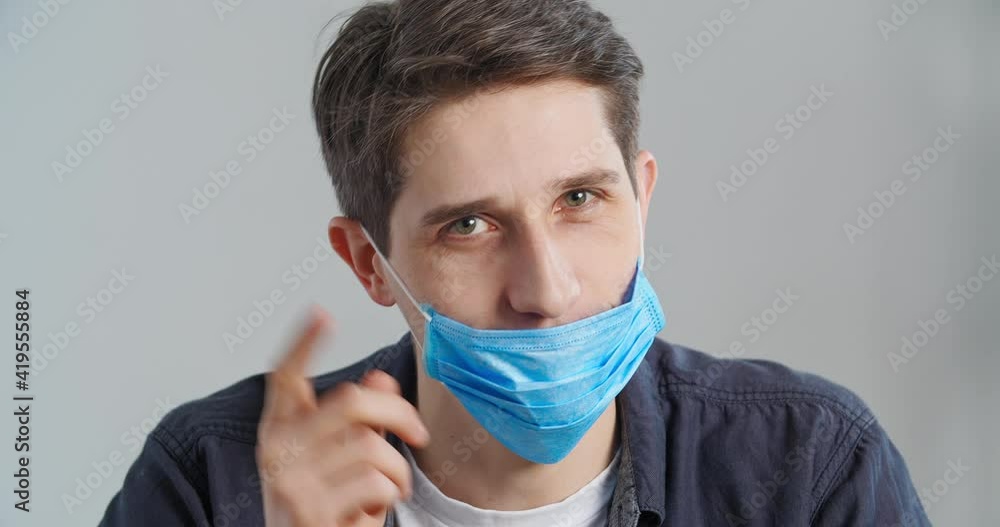 Portrait of responsible man looking at camera demonstrates how to ...