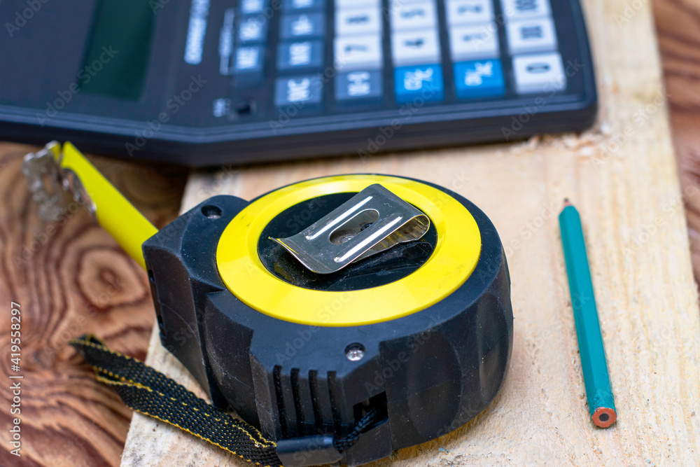 construction meter-tape measure calculator for calculations pencil and ...