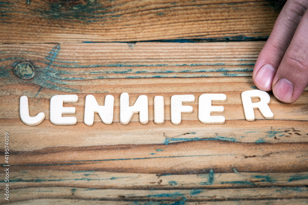 JENNIFER. Name of women and girls. White letters of the alphabet on a ...
