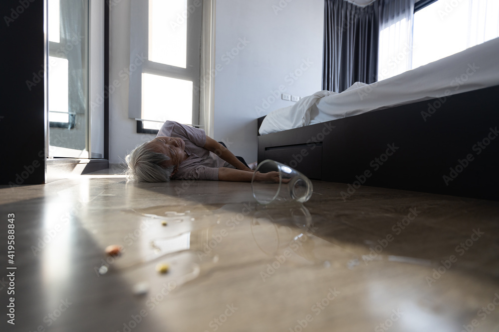 Asian senior woman fainting,unconscious lying on the floor,low blood ...