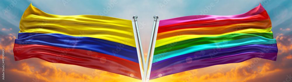 Colombia Flag and Rainbow Flag waving with texture Blue sky could and ...