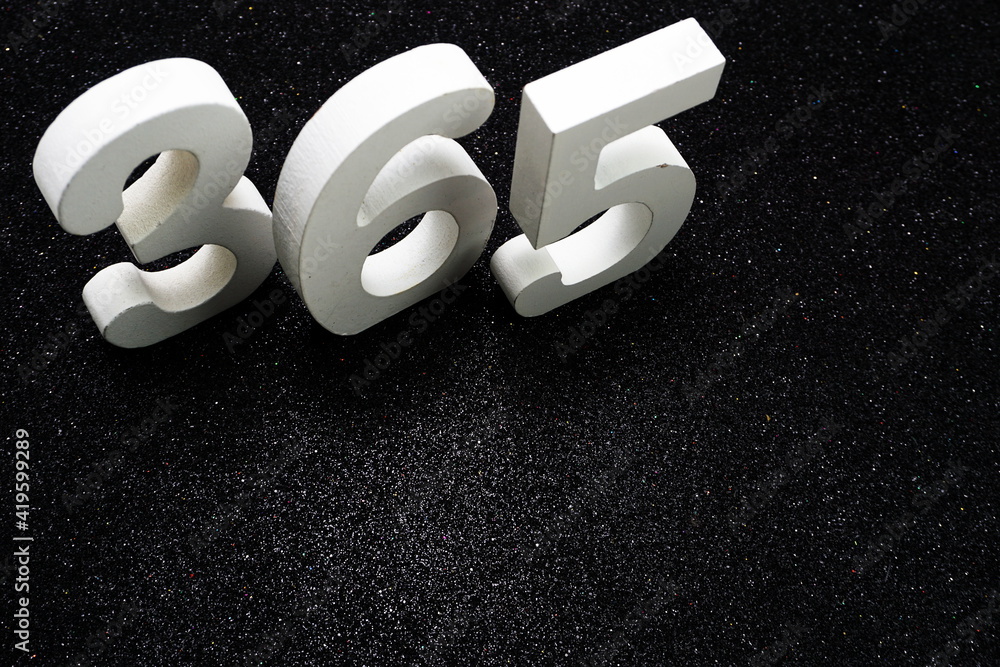365 days alphabet letter with space copy on black glitter background ...