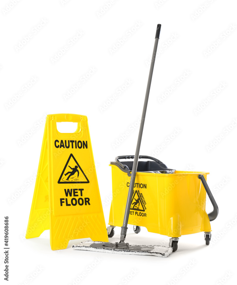 Safety sign with phrase Caution wet floor, mop and bucket on white ...