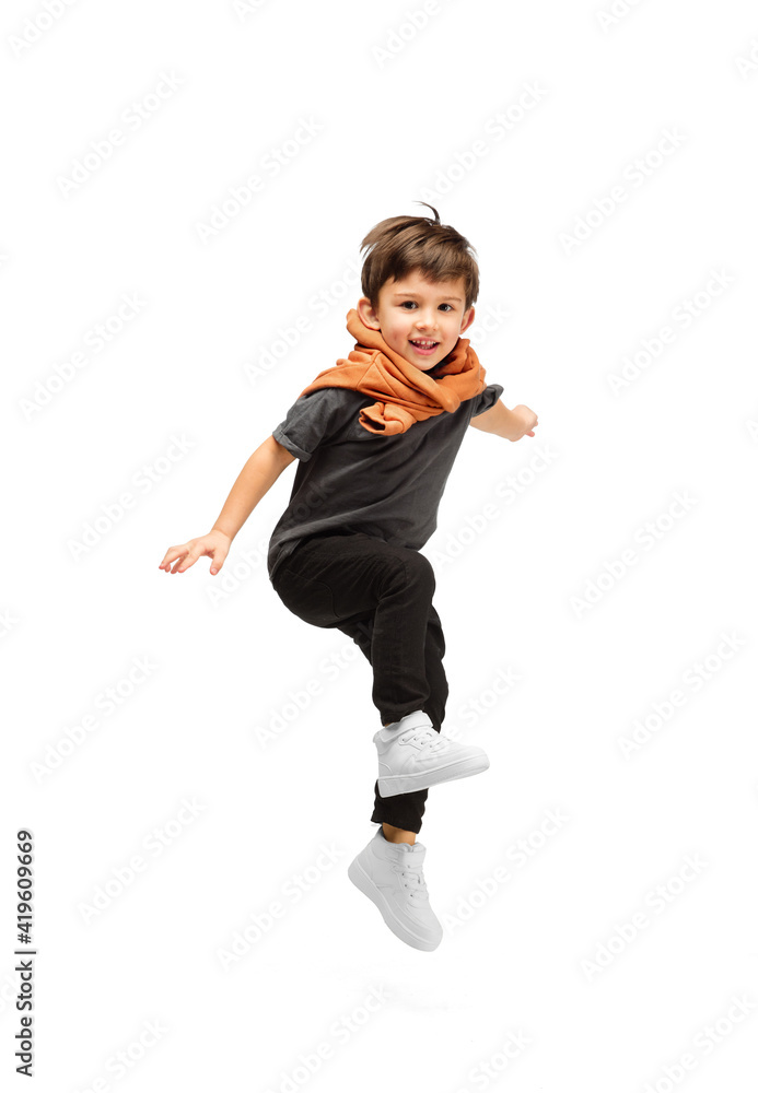 Jumping, running. Happy, smiley little caucasian boy isolated on white ...