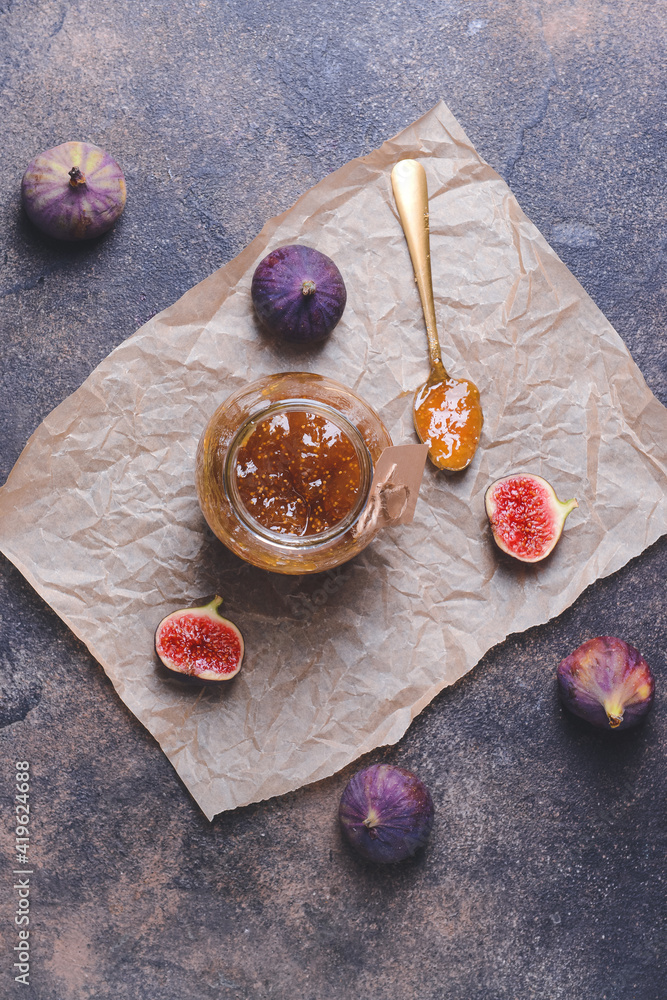 Glass jar with sweet fig jam on color background Stock Photo | Adobe Stock
